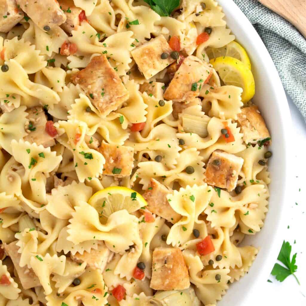 Easy Chicken Piccata Pasta w/ Tomatoes and Artichokes - Borrowed Bites
